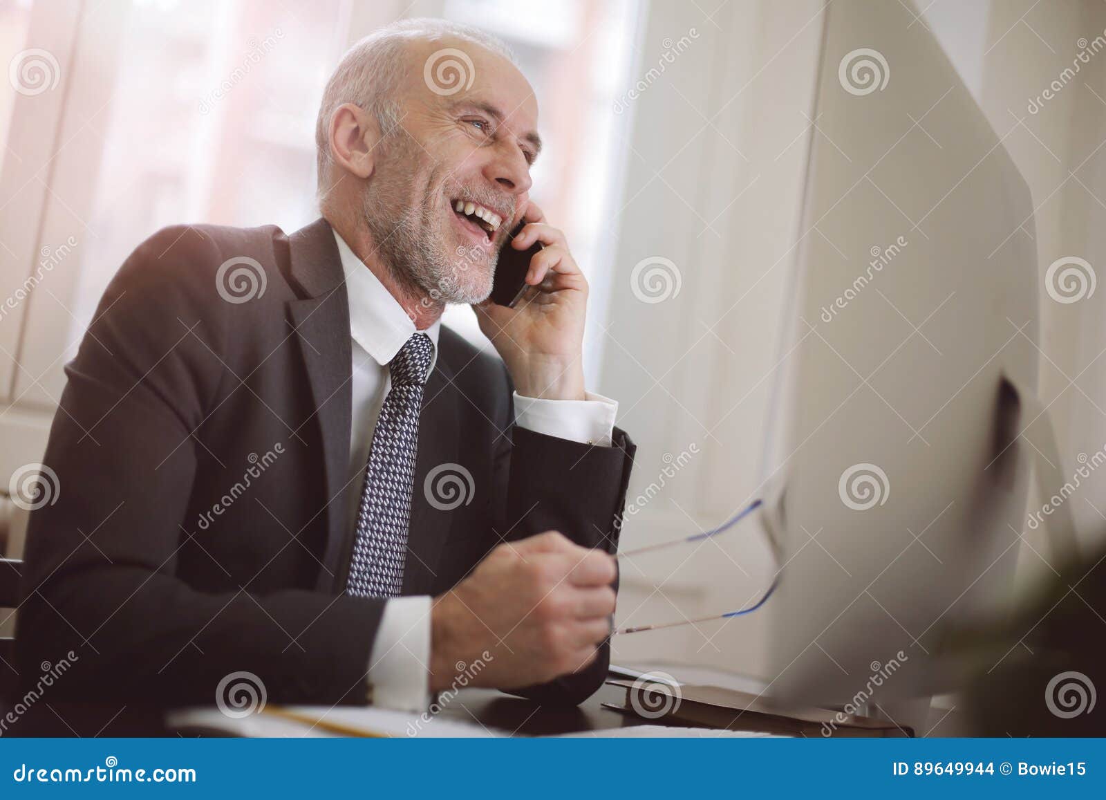 Businessman Laughing on the Phone Stock Photo - Image of caucasian ...