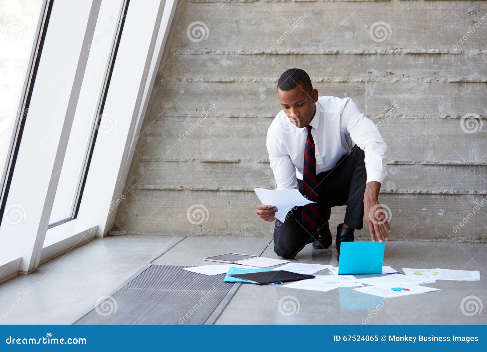 Businessman Laying Documents on Floor To Plan Project Stock Image ...