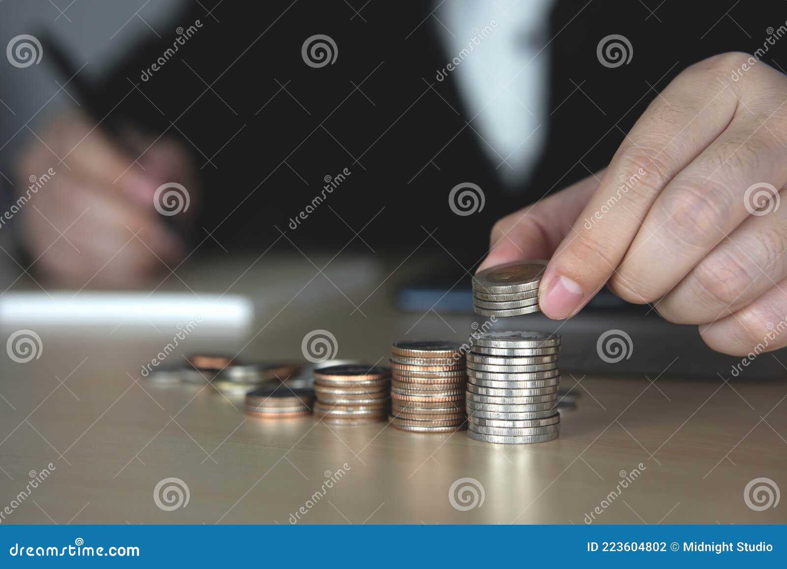 Businessman Laying a Stack of Silver Coins Stock Photo - Image of ...