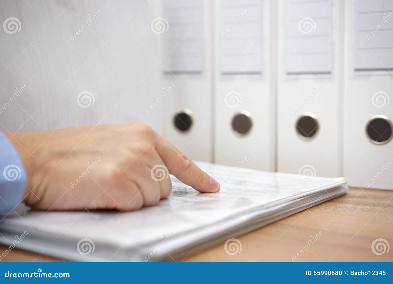 Businessman Leafing through a Documentation Stock Photo - Image of ...