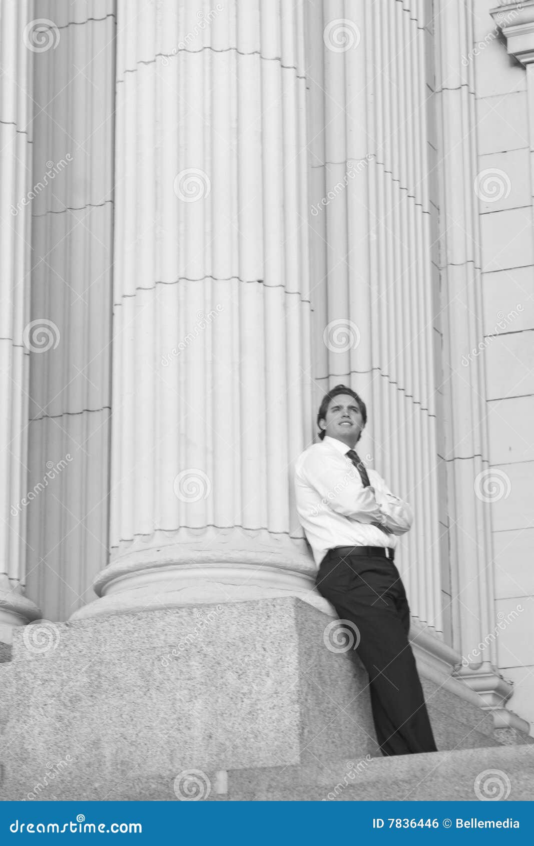 Businessman Leaning Against Column Stock Photo - Image of american ...