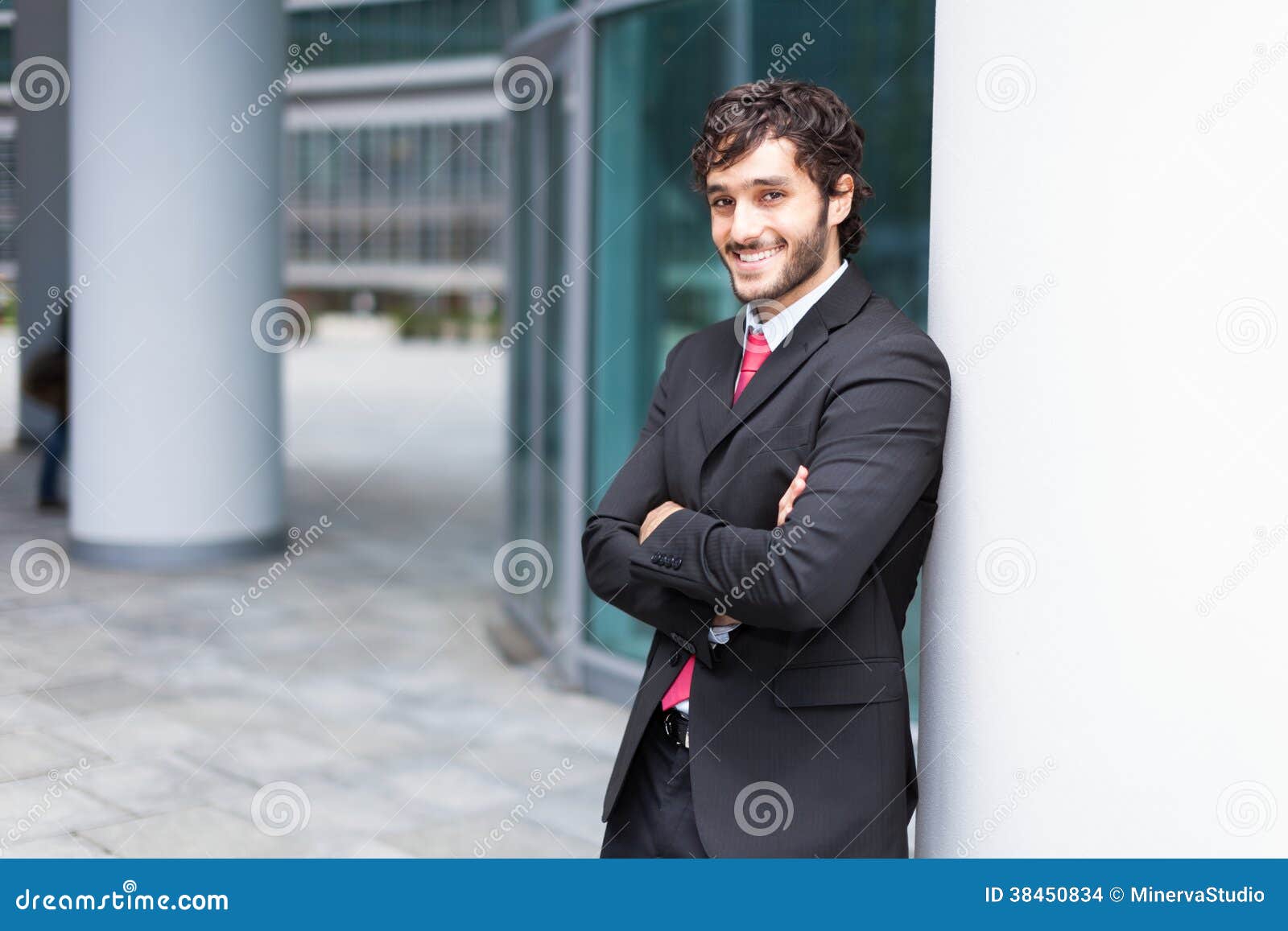 Businessman Leaning on a Column Stock Photo - Image of friendly ...