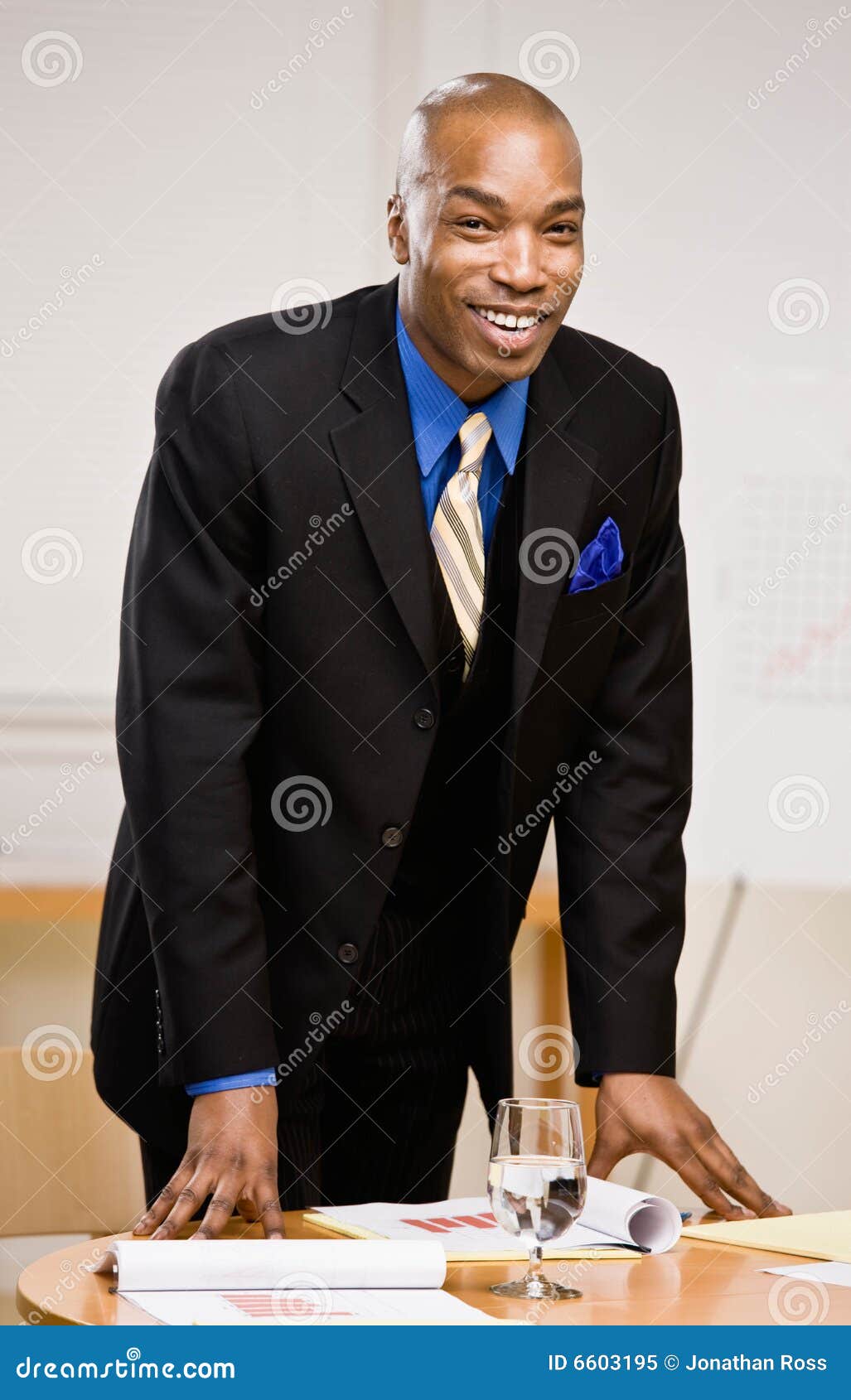 Businessman Leaning on Table in Conference Room Stock Image - Image of ...