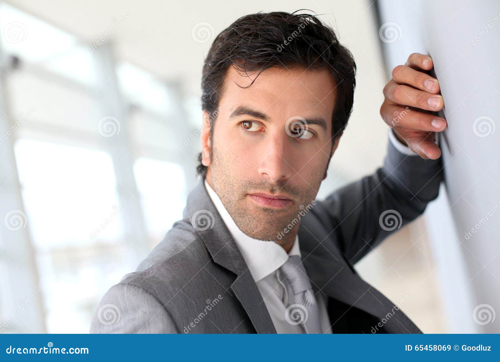Businessman Leaning on the Wall Stock Image - Image of caucasian ...