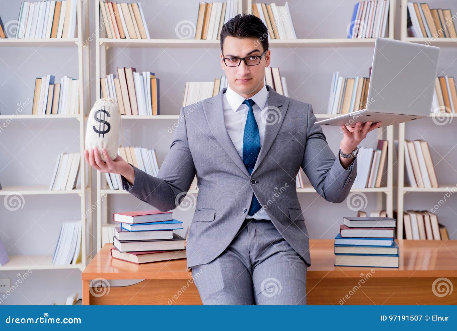 The Businessman in Library with a Money Sack and a Laptop Stock Image ...