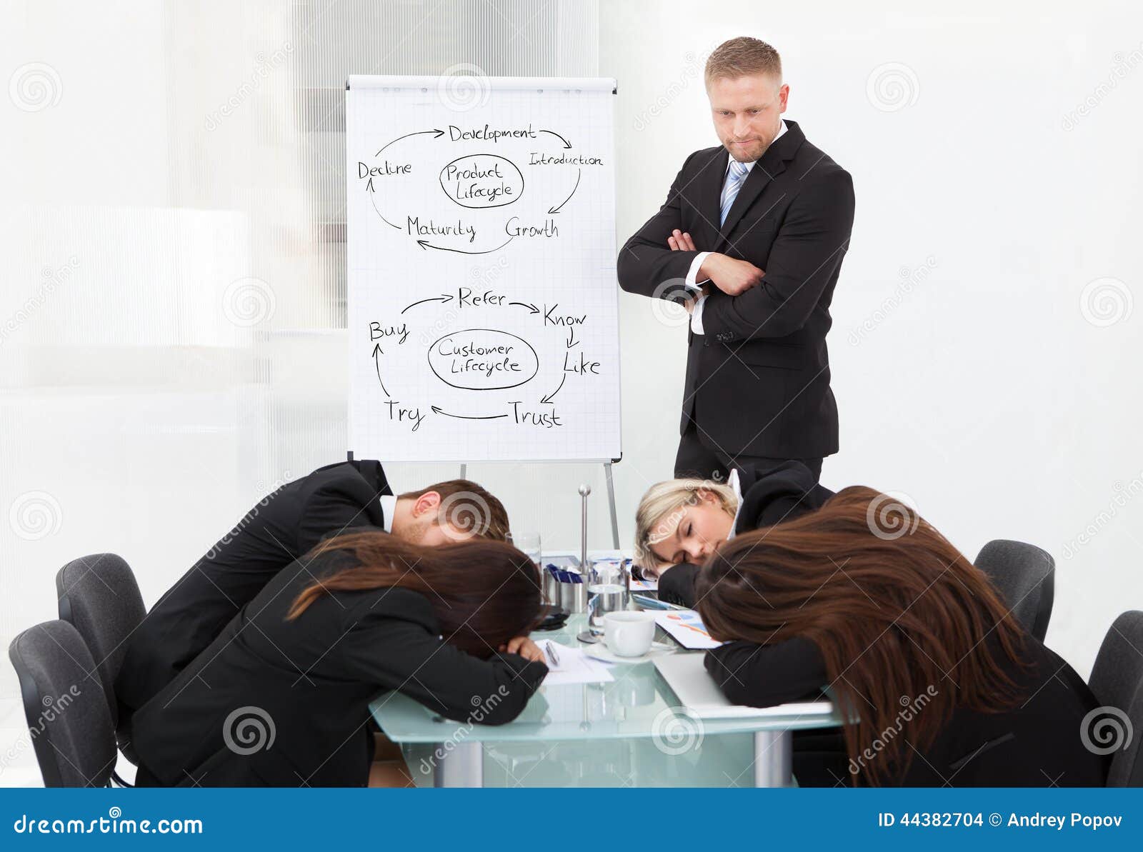 Businessman Looking at Colleagues Sleeping during Presentation Stock ...