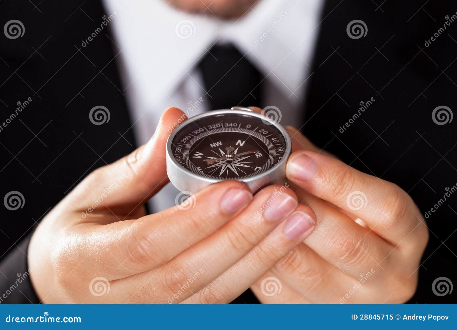 Businessman Looking at a Compass Stock Image - Image of direction ...