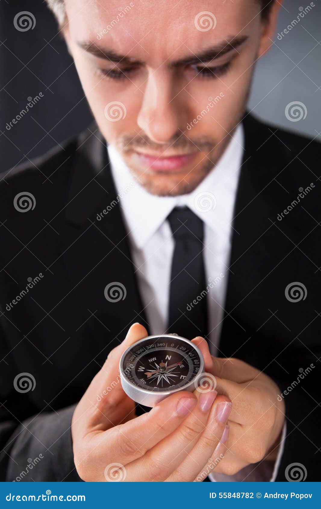 Businessman Looking at a Compass Stock Photo - Image of concepts ...