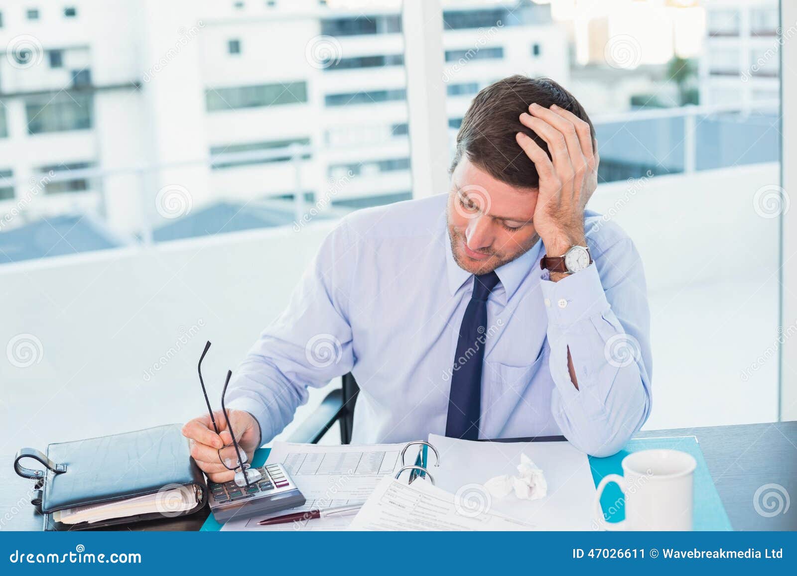 Businessman Looking at Documents Stock Image - Image of focused, boring ...