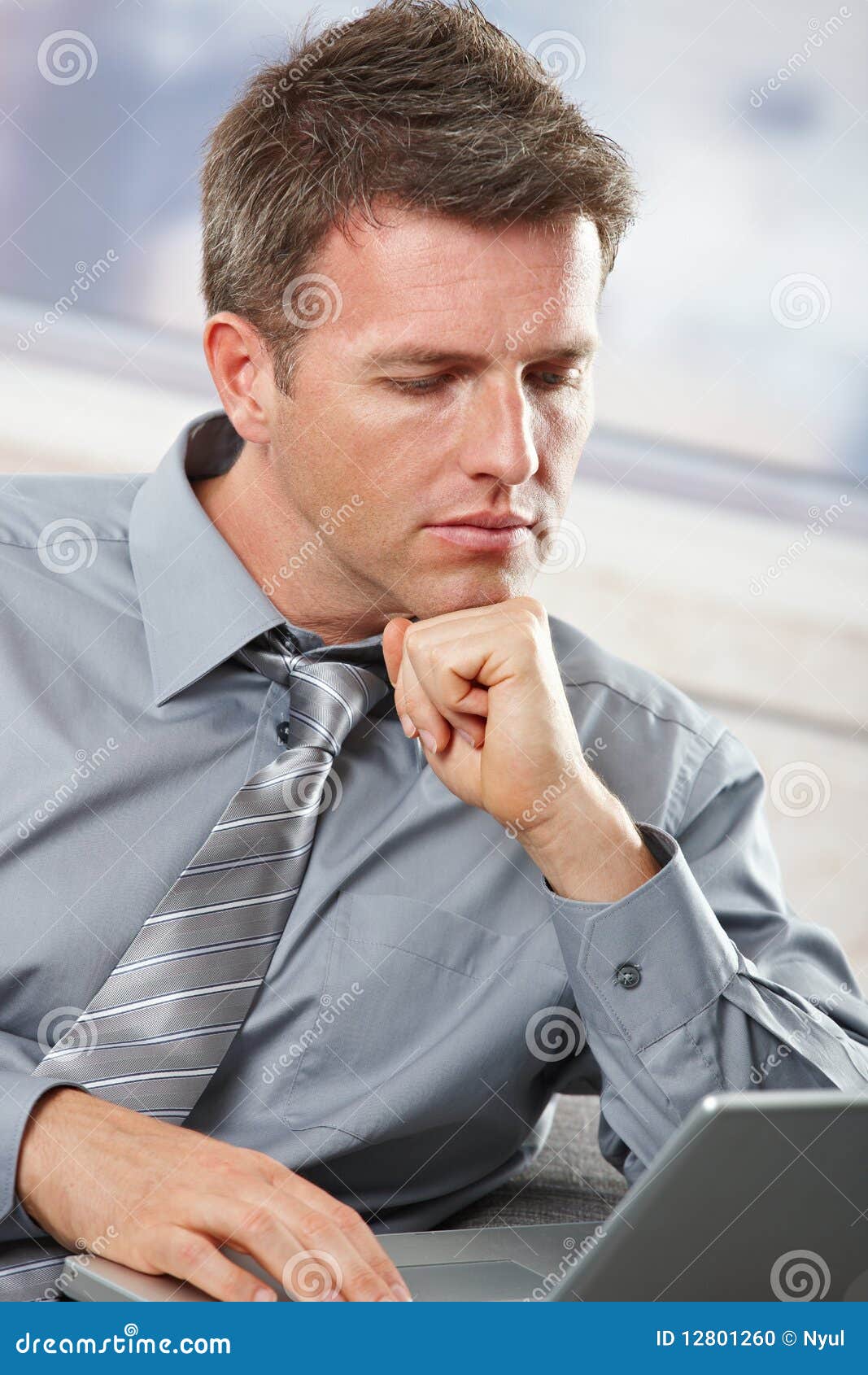 Businessman Looking Down at Computer Stock Photo - Image of color ...