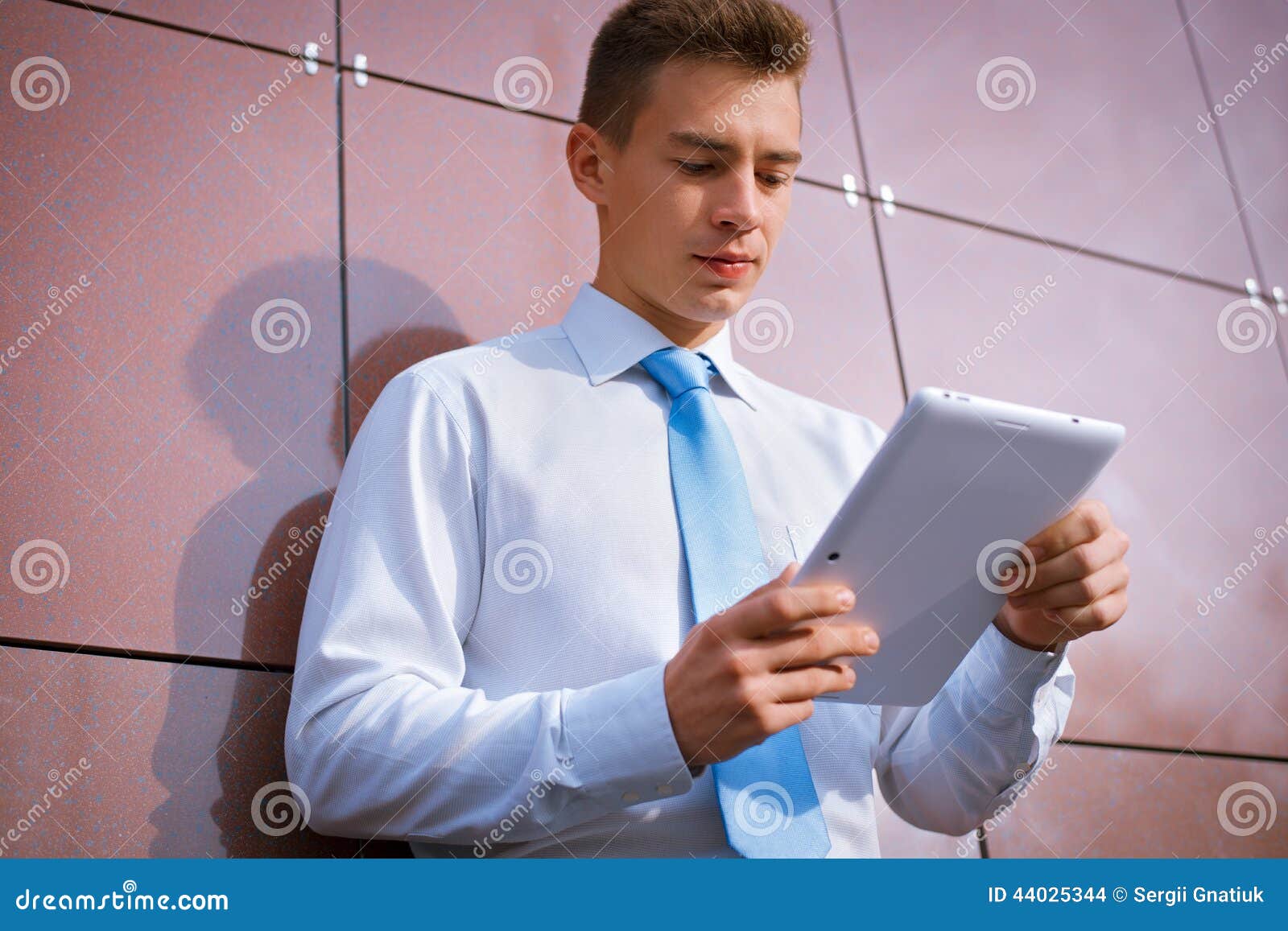 Businessman Looking Down at Tablet Computer Stock Photo - Image of ...