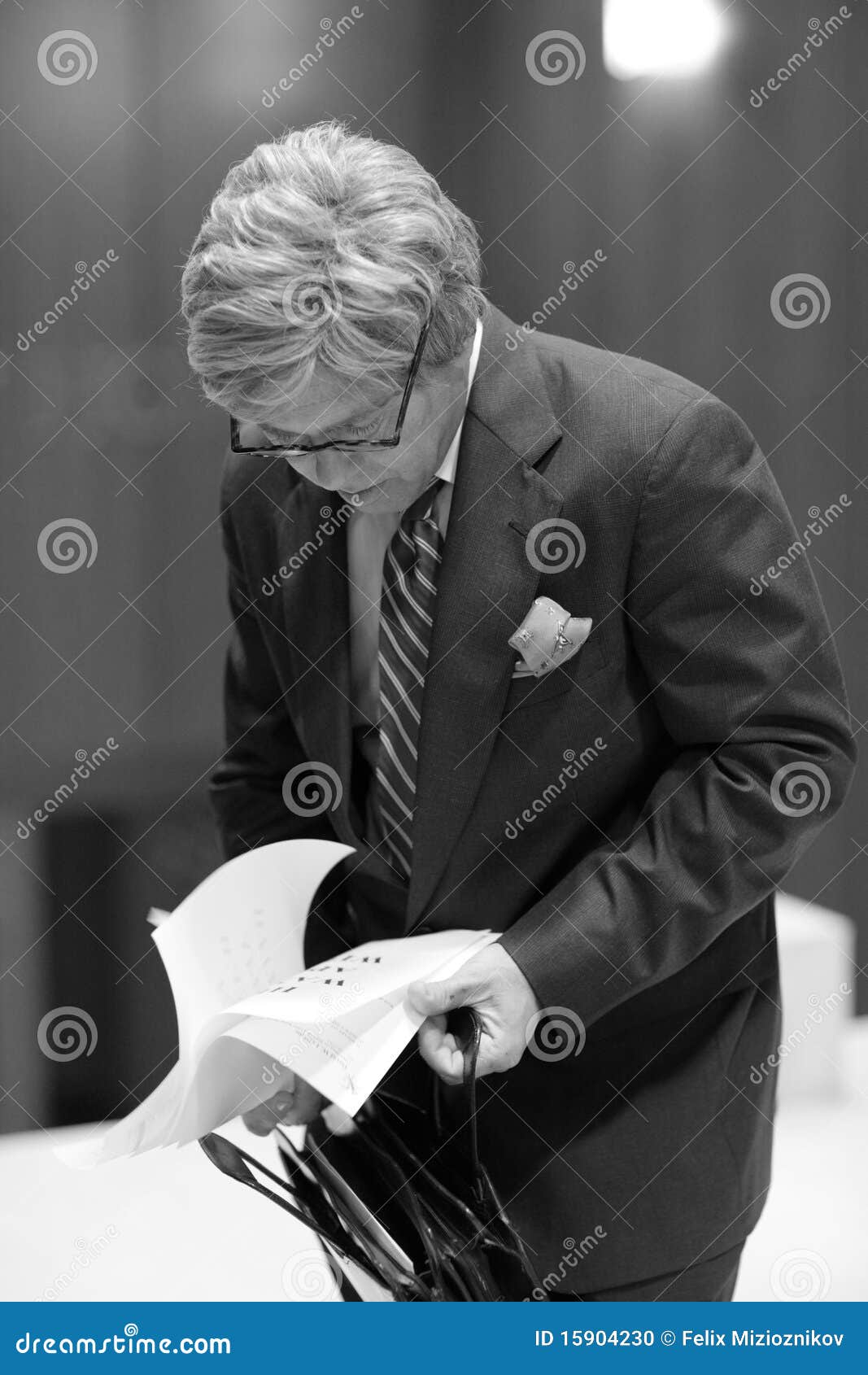 Businessman Looking through Files Stock Photo - Image of sifting, retro ...