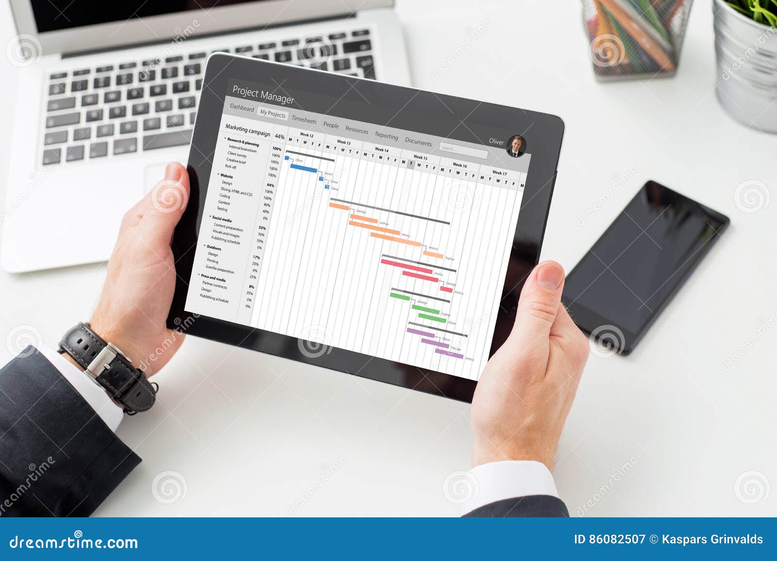 Businessman Looking at Gantt Chart on Tablet Computer Stock Image ...