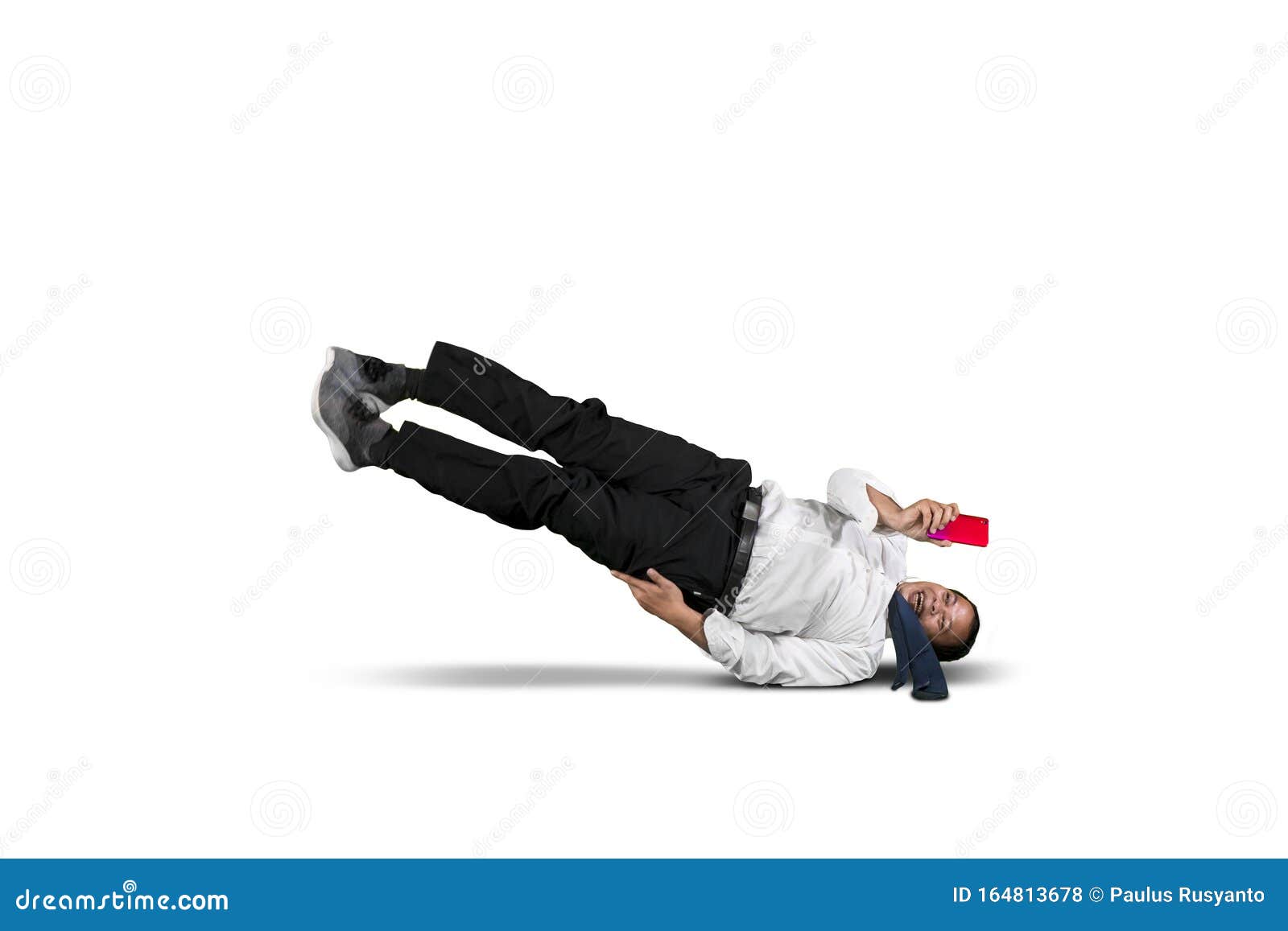 Businessman Looking at His Smart Phone while Falling Stock Photo ...