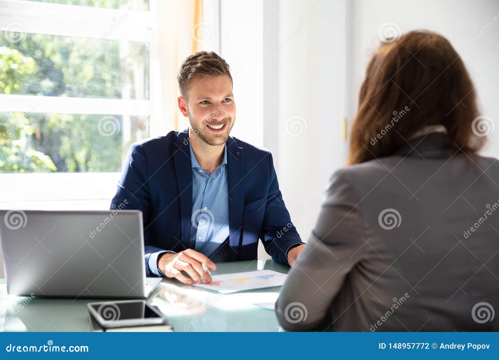 Businessman Looking at Job Candidate Stock Photo - Image of female ...