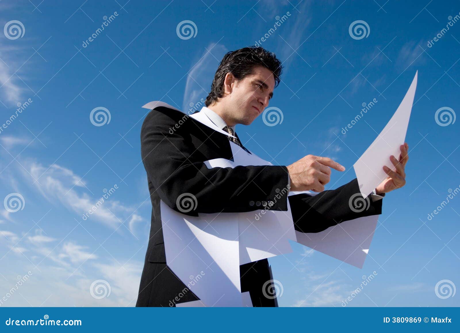 Businessman Looking Over Paperwork Stock Image - Image of financial ...
