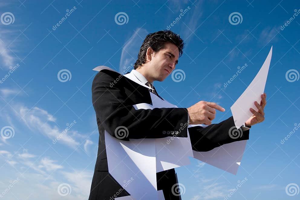Businessman Looking Over Paperwork Stock Image - Image of financial ...
