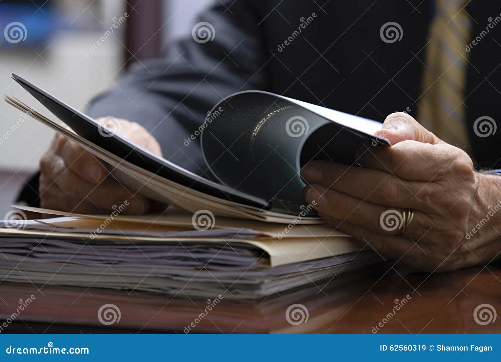 Businessman Looking at Paperwork Stock Image - Image of information ...