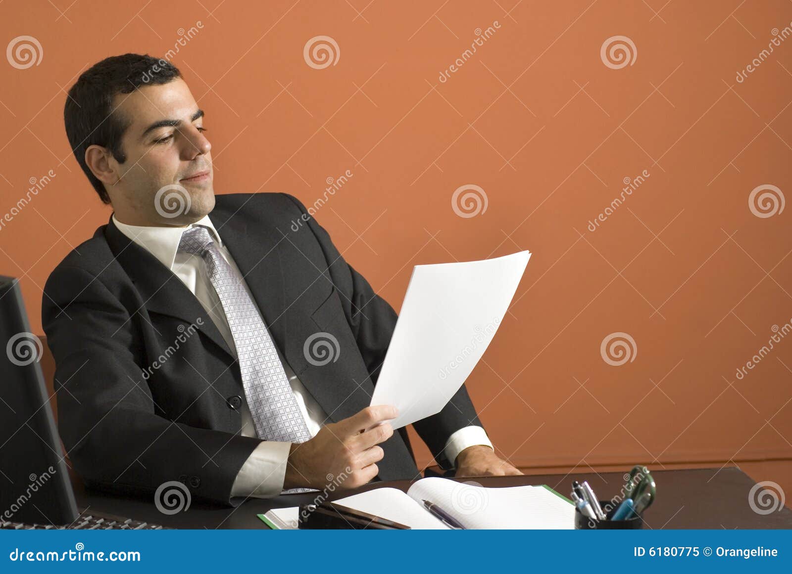 Businessman Looking at Paperwork - Horizontal Stock Image - Image of ...