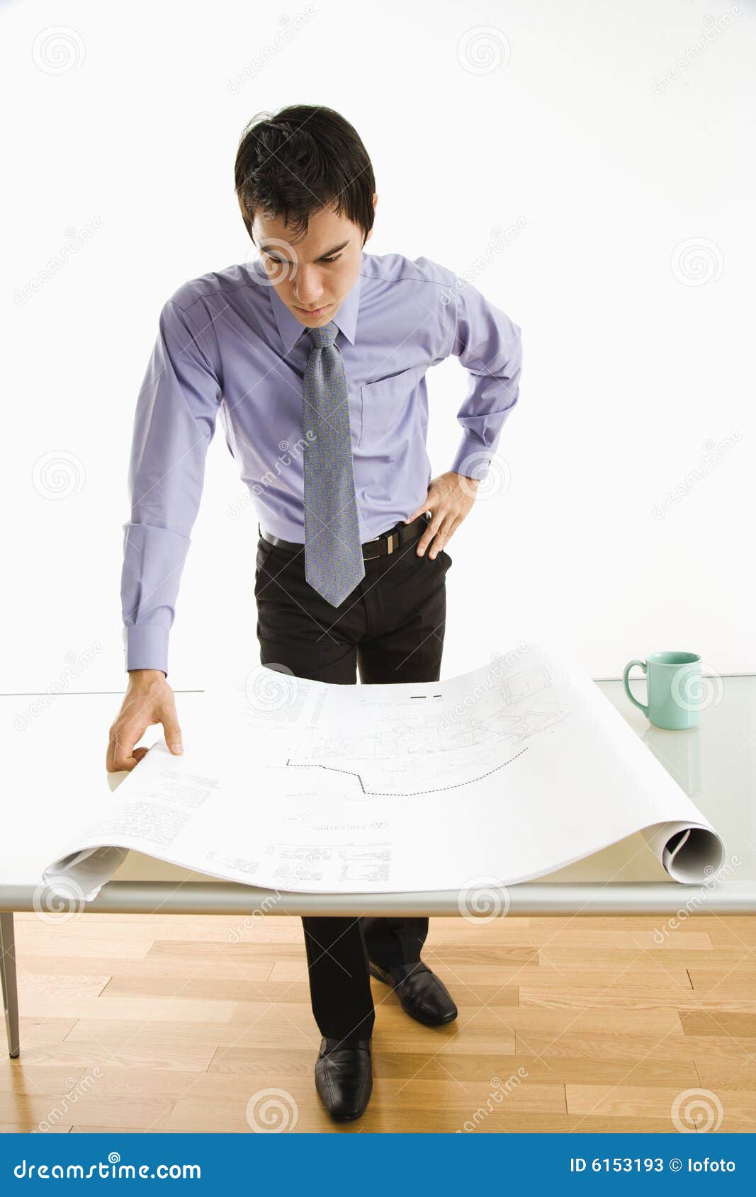 Businessman Looking at Plans. Stock Image - Image of desk, photograph ...