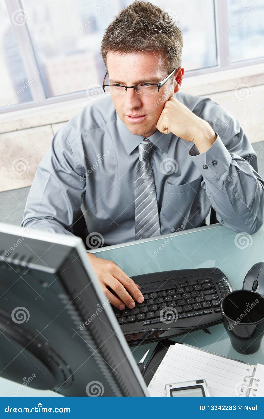 Businessman Looking at Screen in Office Stock Image - Image of angle ...