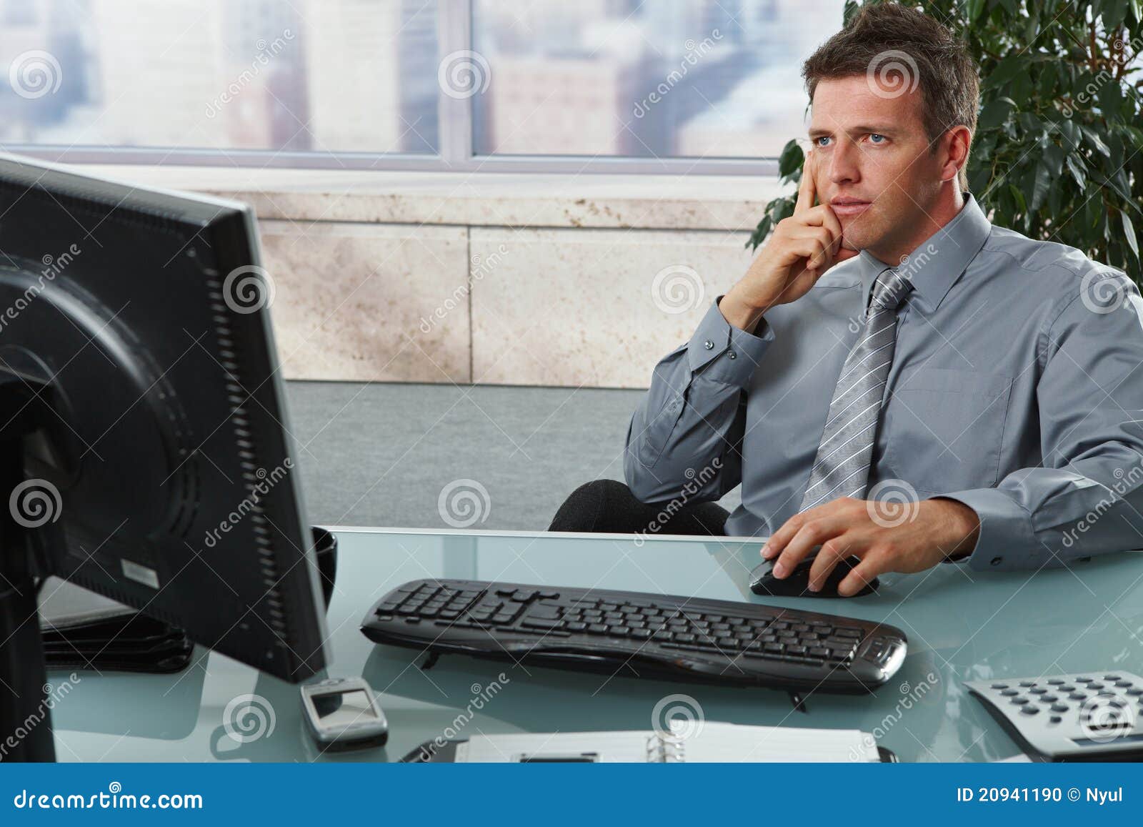 Businessman Looking at Screen in Office Stock Photo - Image of desktop ...