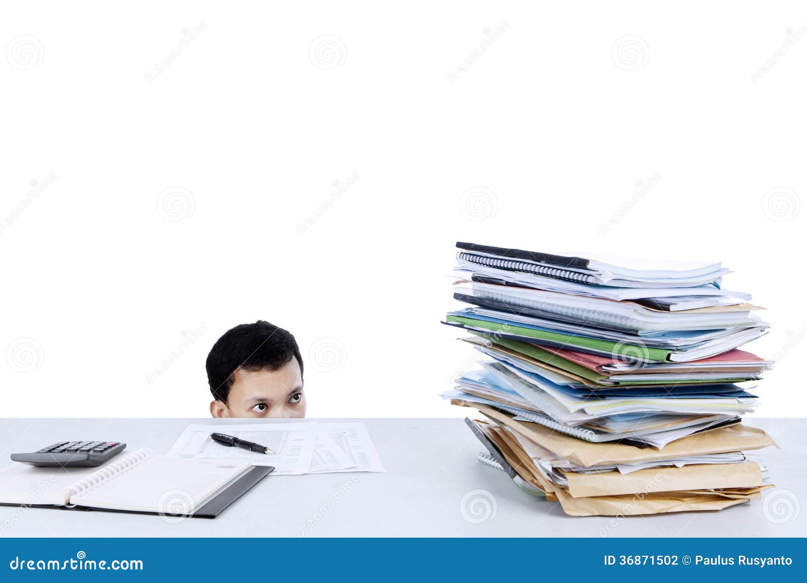 Businessman Looking at Stack of Files Stock Photo - Image of indonesian ...