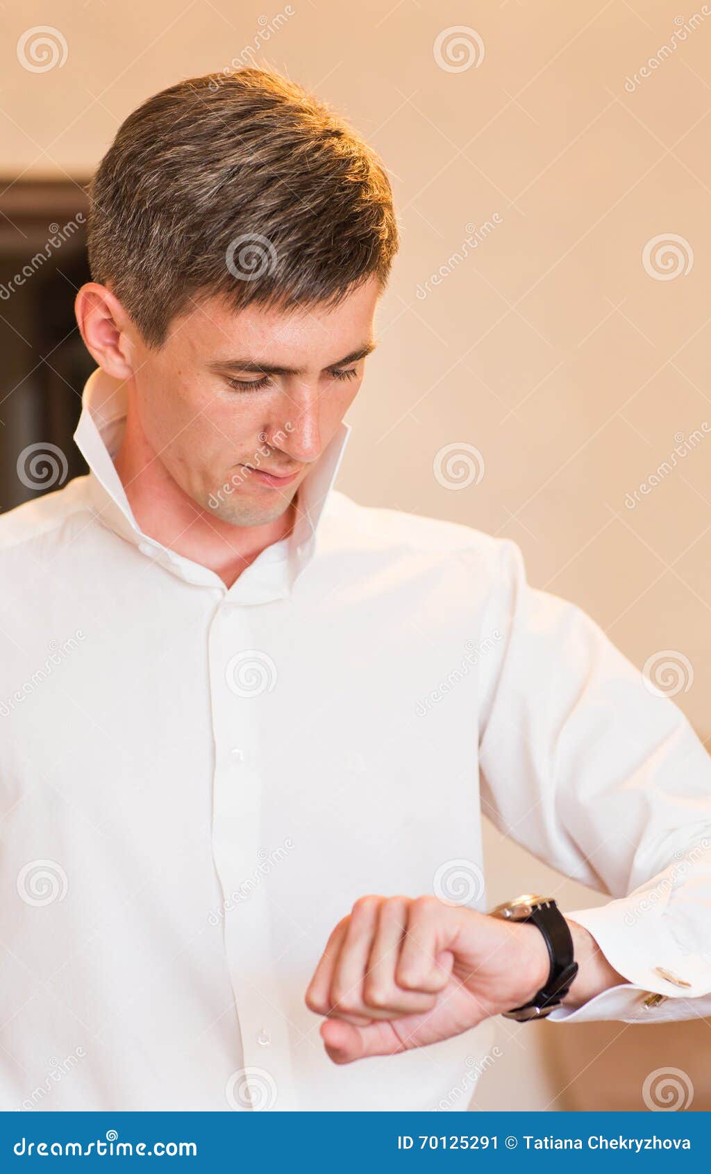 Businessman Looking at the Time on His Wrist Watch. Stock Image - Image ...