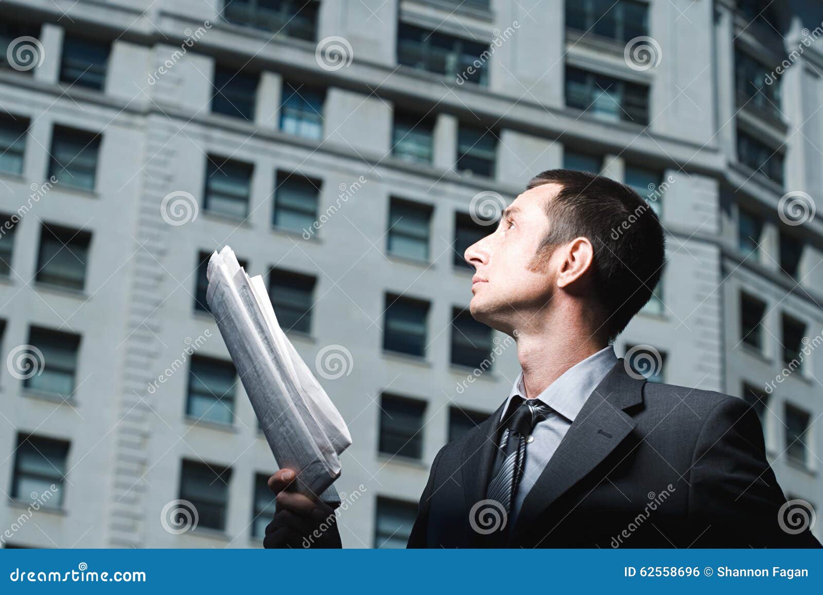 Businessman looking up stock photo. Image of headshot - 62558696