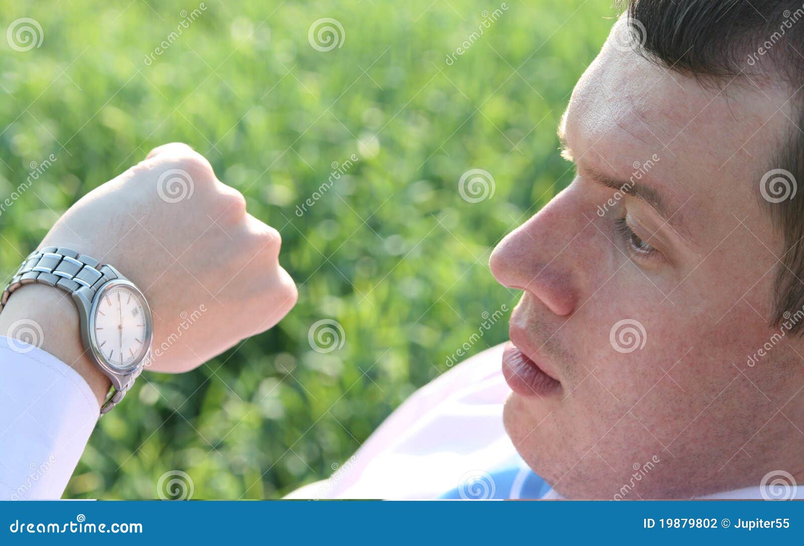 Businessman Looking at Watch Stock Photo - Image of field, chair: 19879802