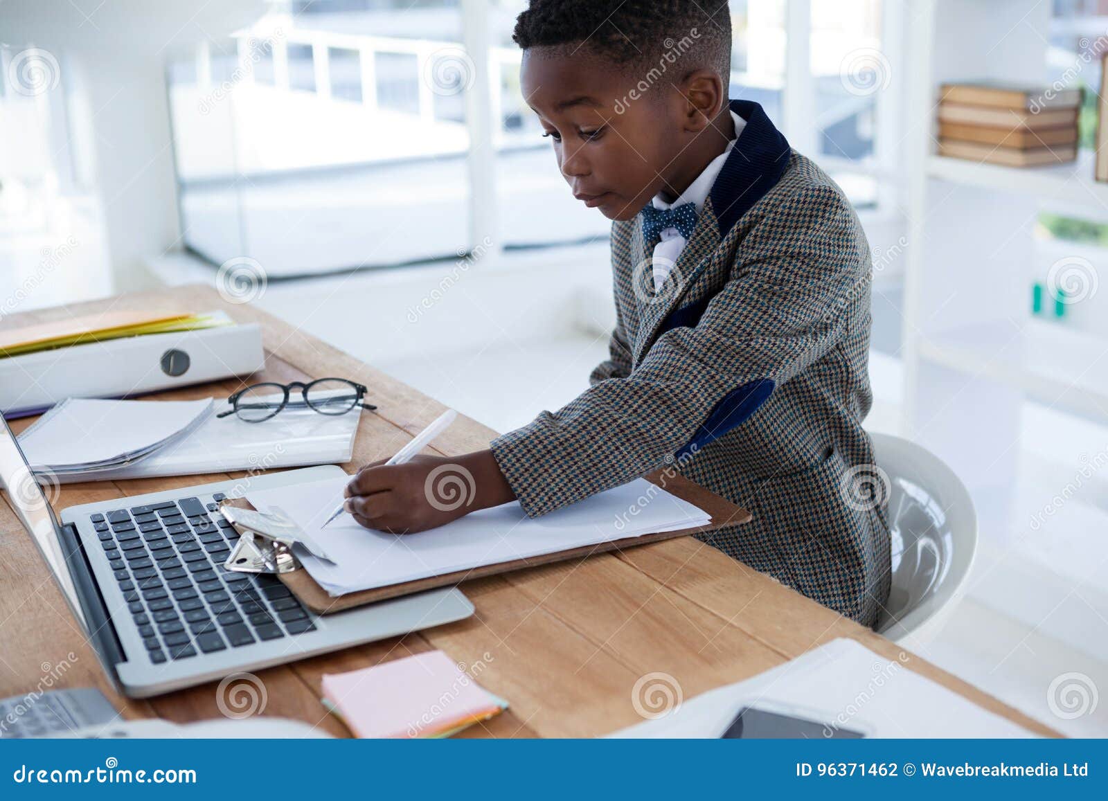 Businessman Making Face while Writing on Paper Stock Photo - Image of ...