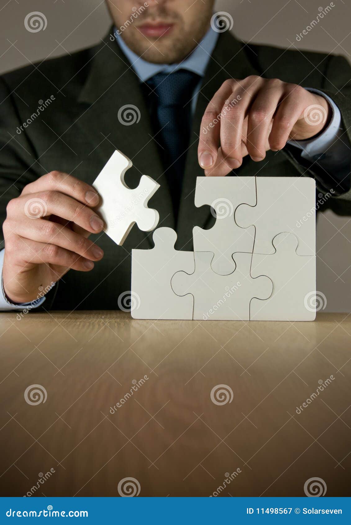 Businessman Making a Puzzle Stock Image - Image of professional ...
