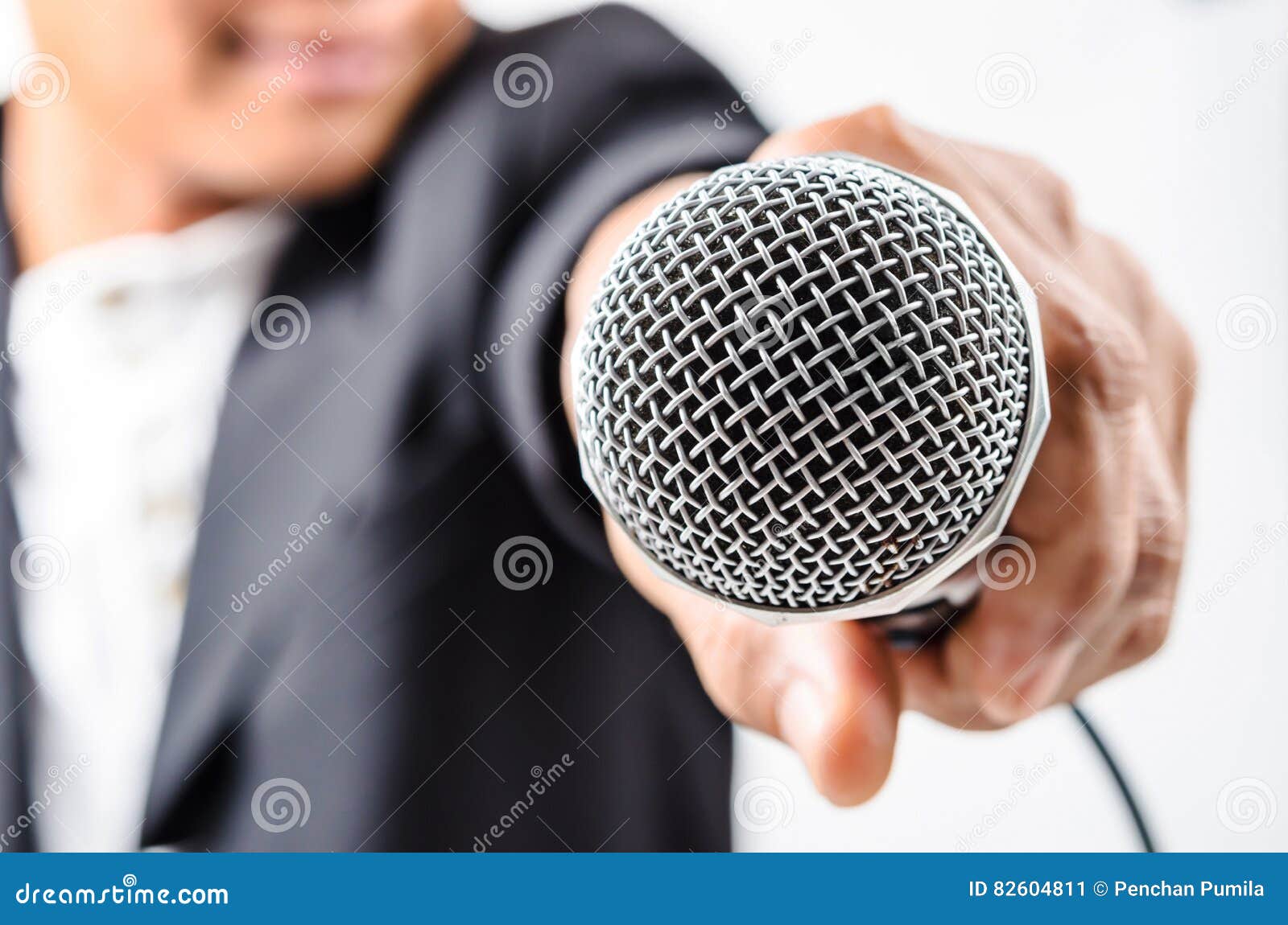 Businessman Making Speech with Microphone and Hand Gesturing. Stock ...
