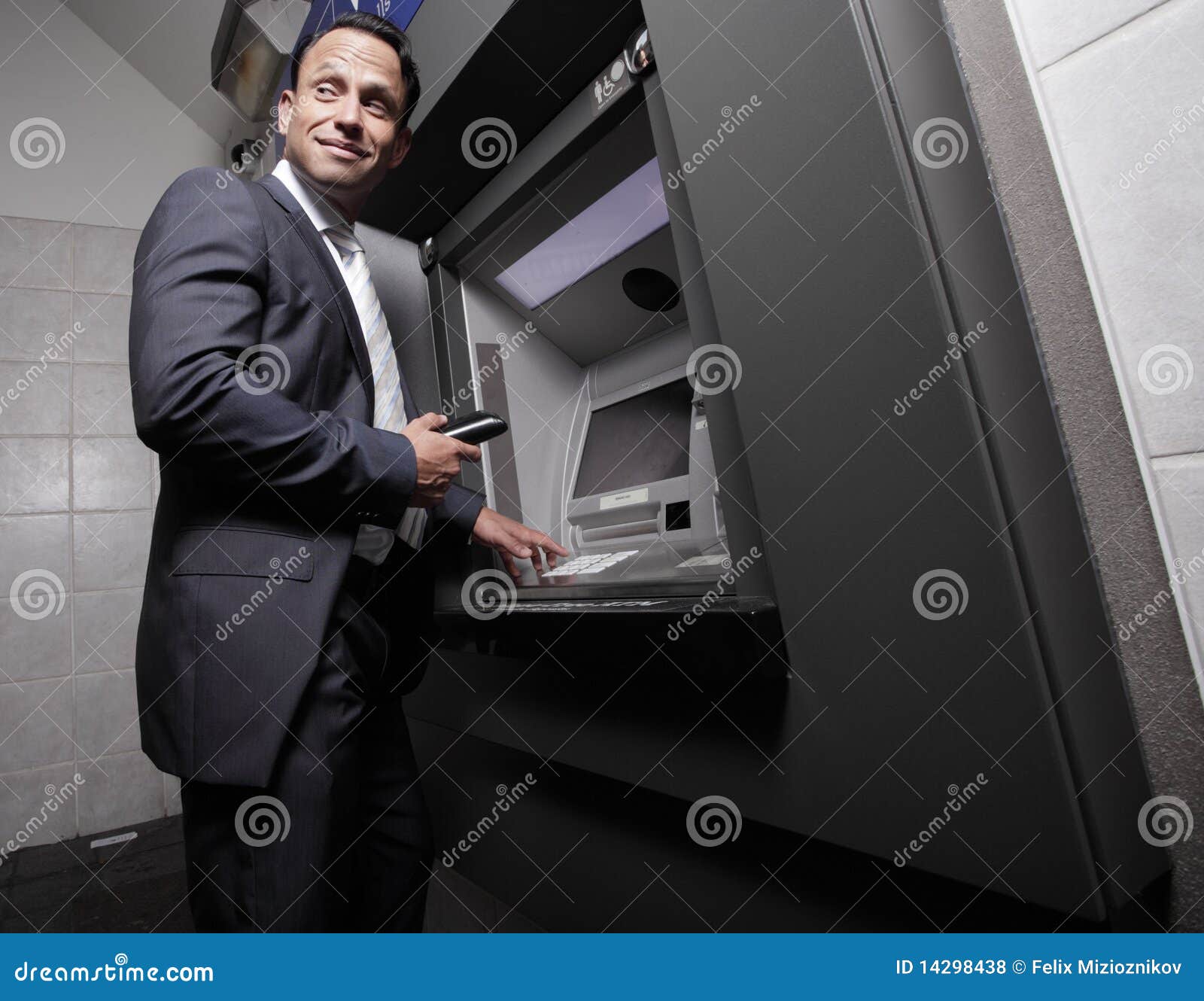 Businessman Making a Withdrawal Stock Photo - Image of perspective ...