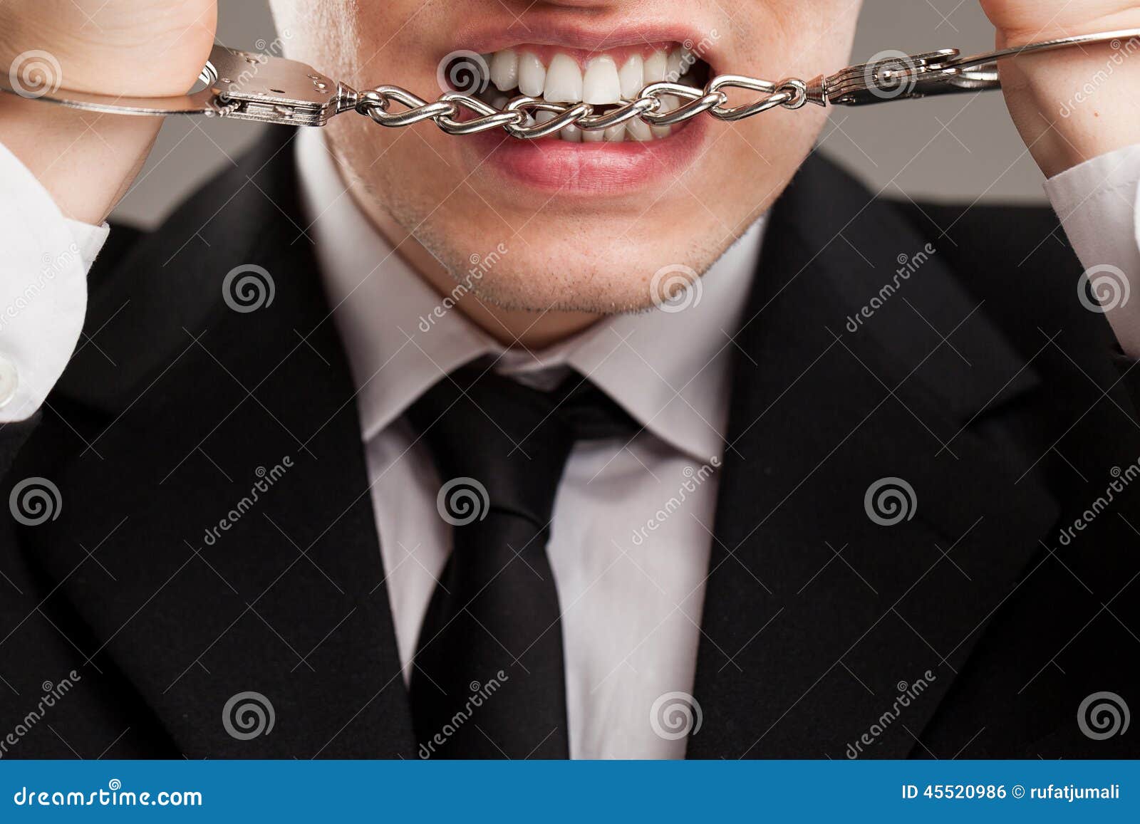 Businessman with Manacles on His Hands Stock Photo - Image of ...
