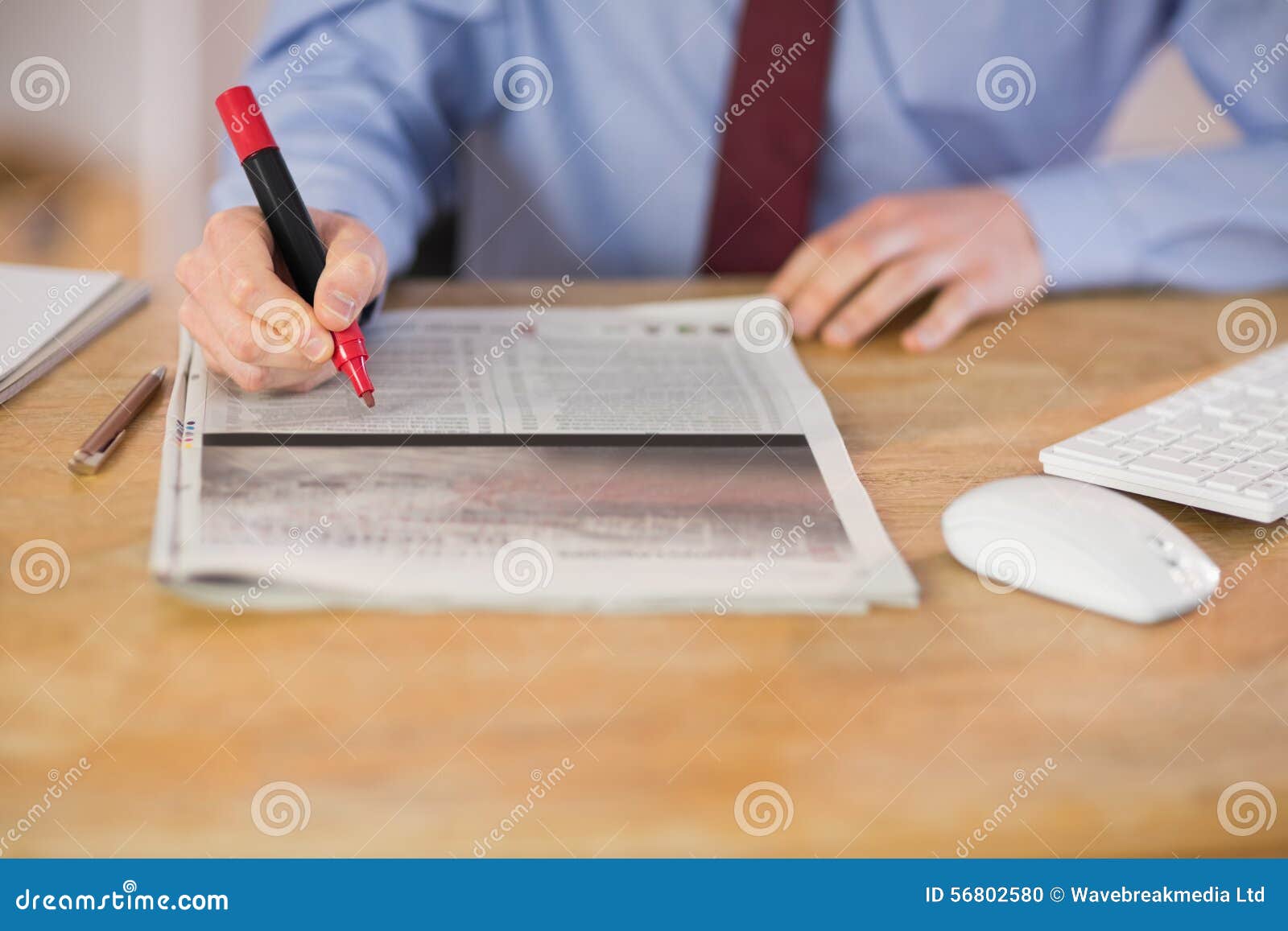Businessman Marking the Newspaper with Marker Stock Photo - Image of ...