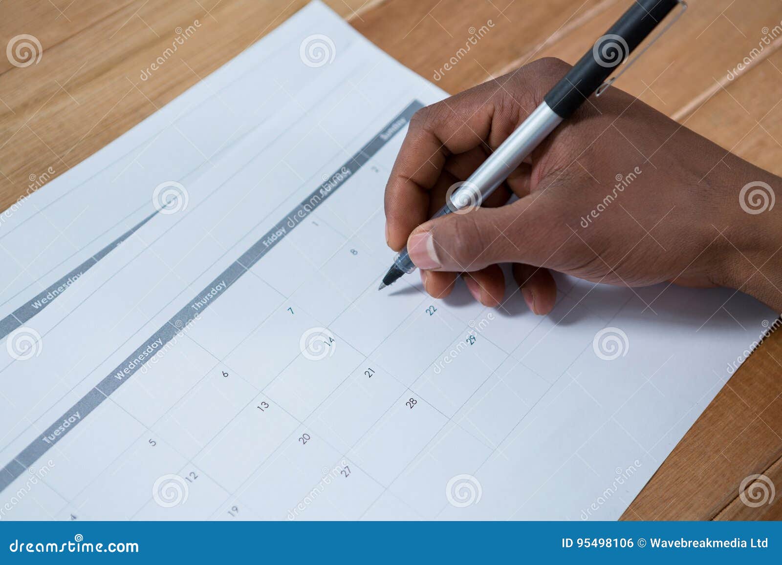 Businessman Marking with Pen on Calendar Stock Photo - Image of table ...