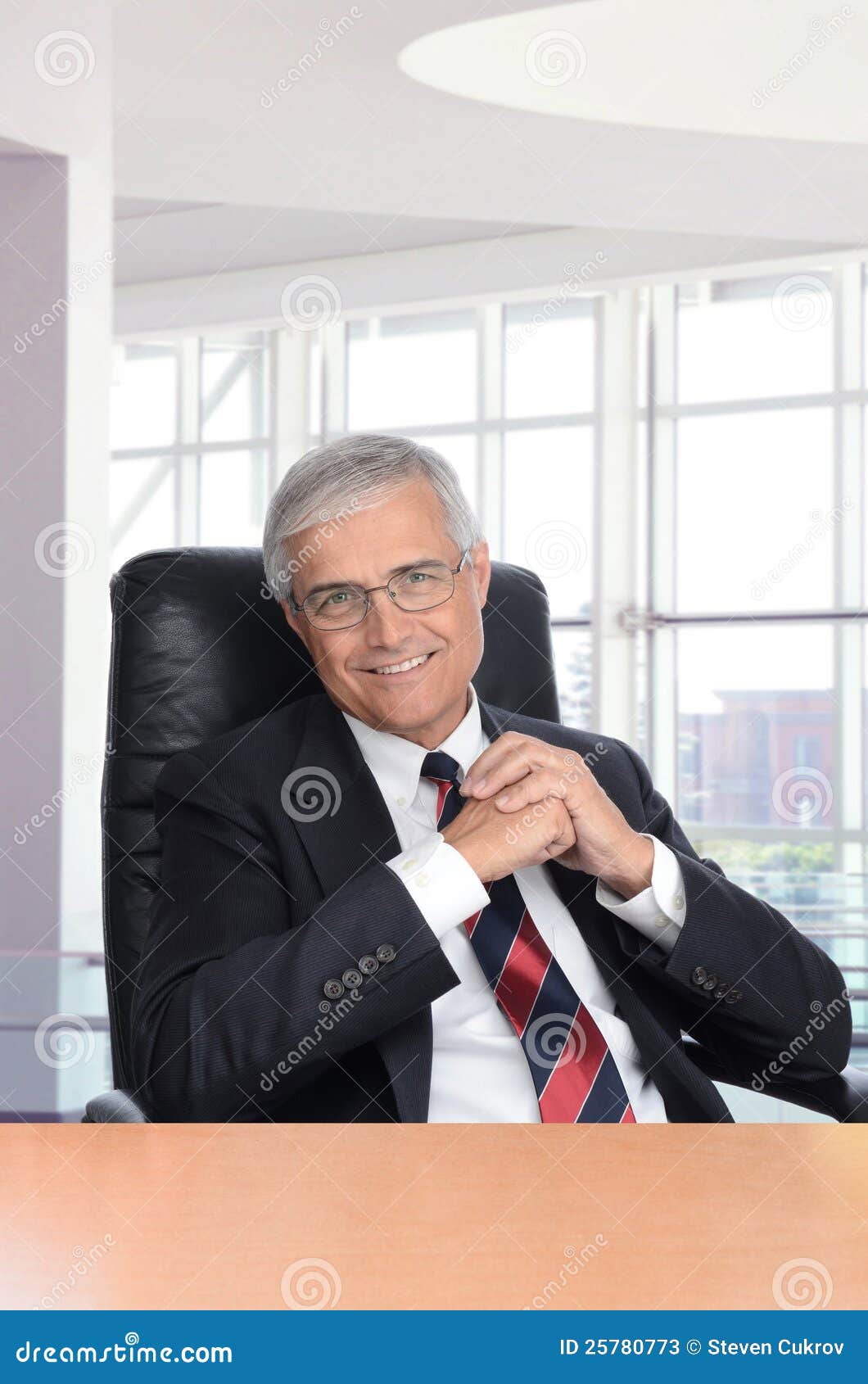 Businessman in Modern Office Setting Stock Image - Image of seated ...