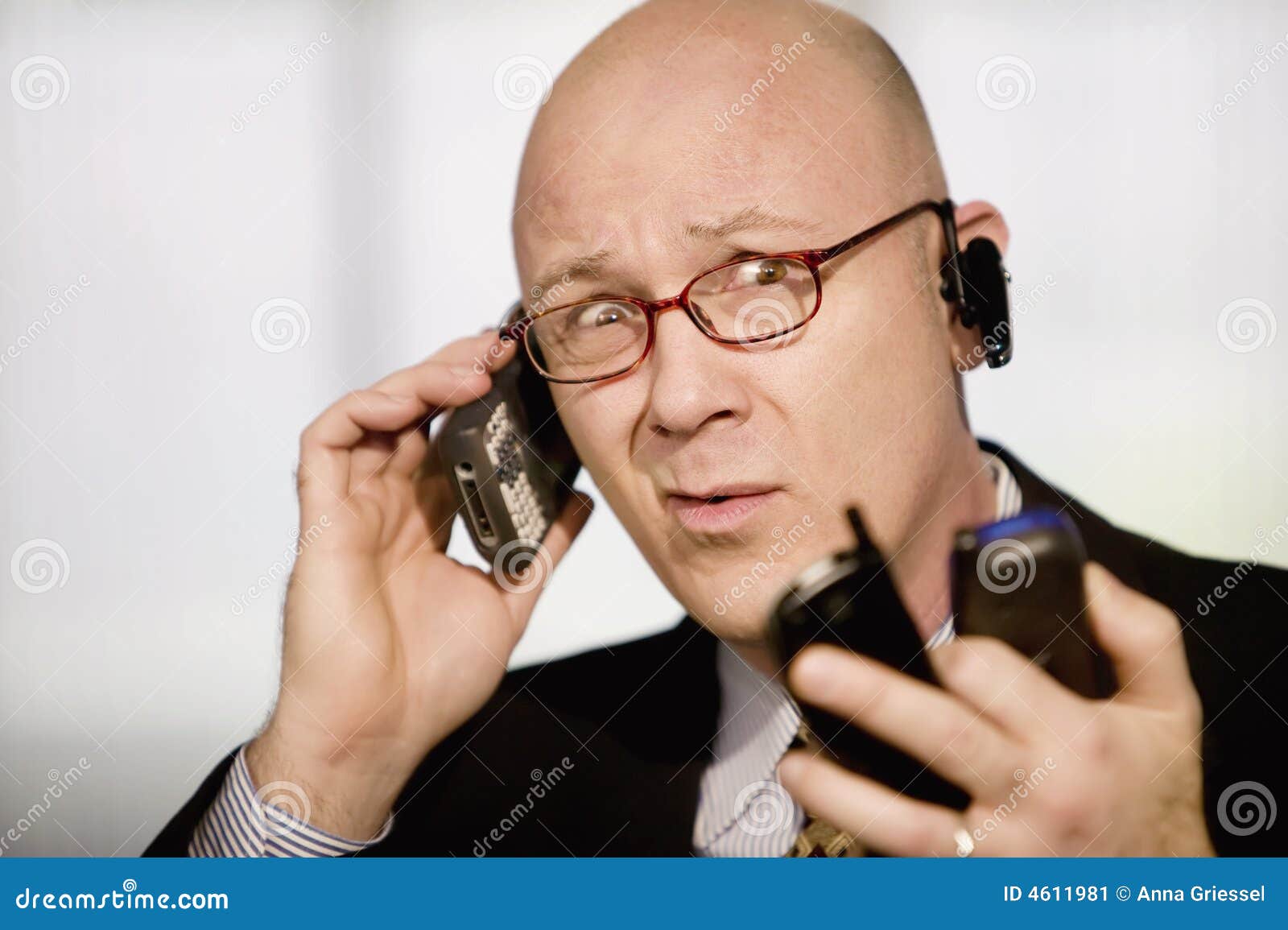 Businessman with Multiple Cell Phones Stock Image - Image of boss ...