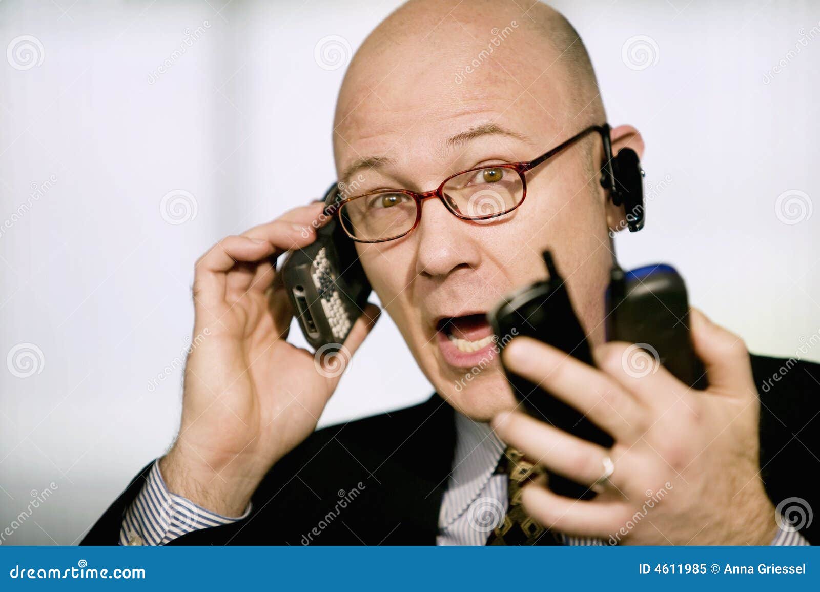 Businessman With Multiple Cell Phones Royalty Free Stock Photo - Image ...