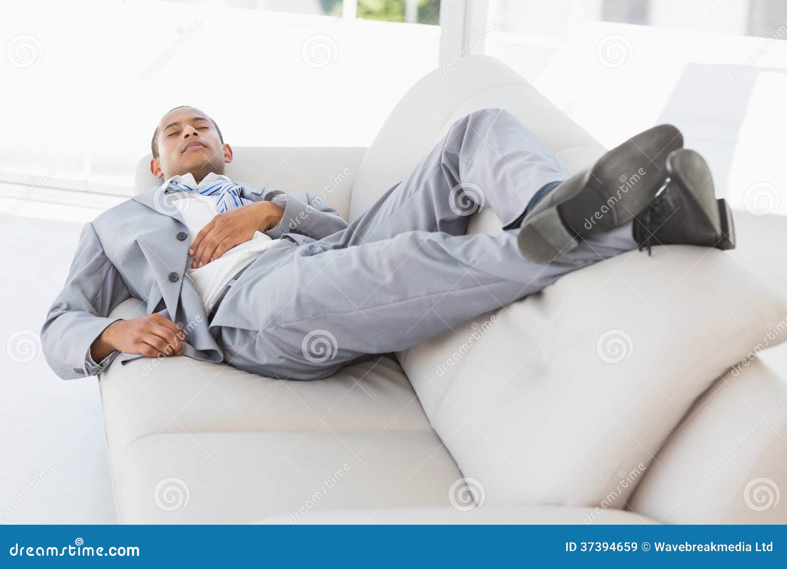 Businessman Napping on the Couch Stock Image - Image of mixedrace ...