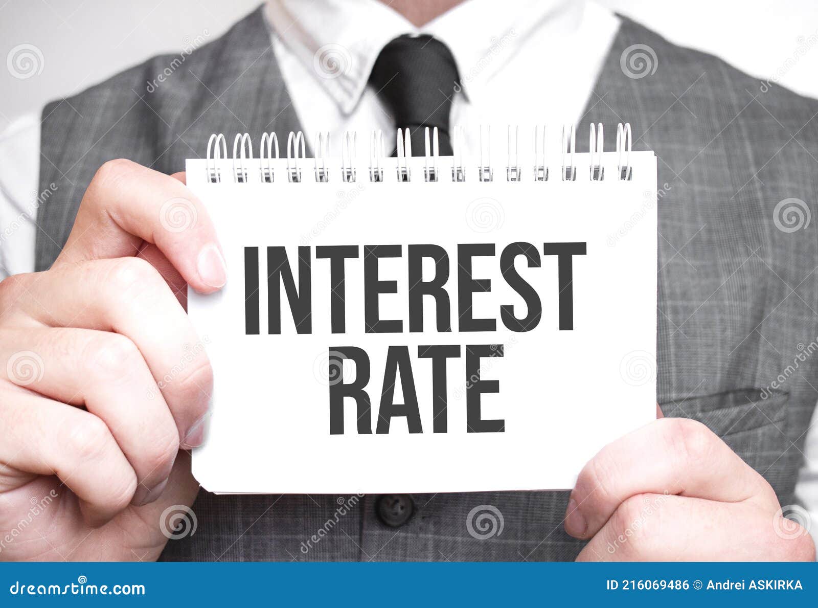 Businessman with Notebook with Text Interest Rate Stock Photo - Image ...