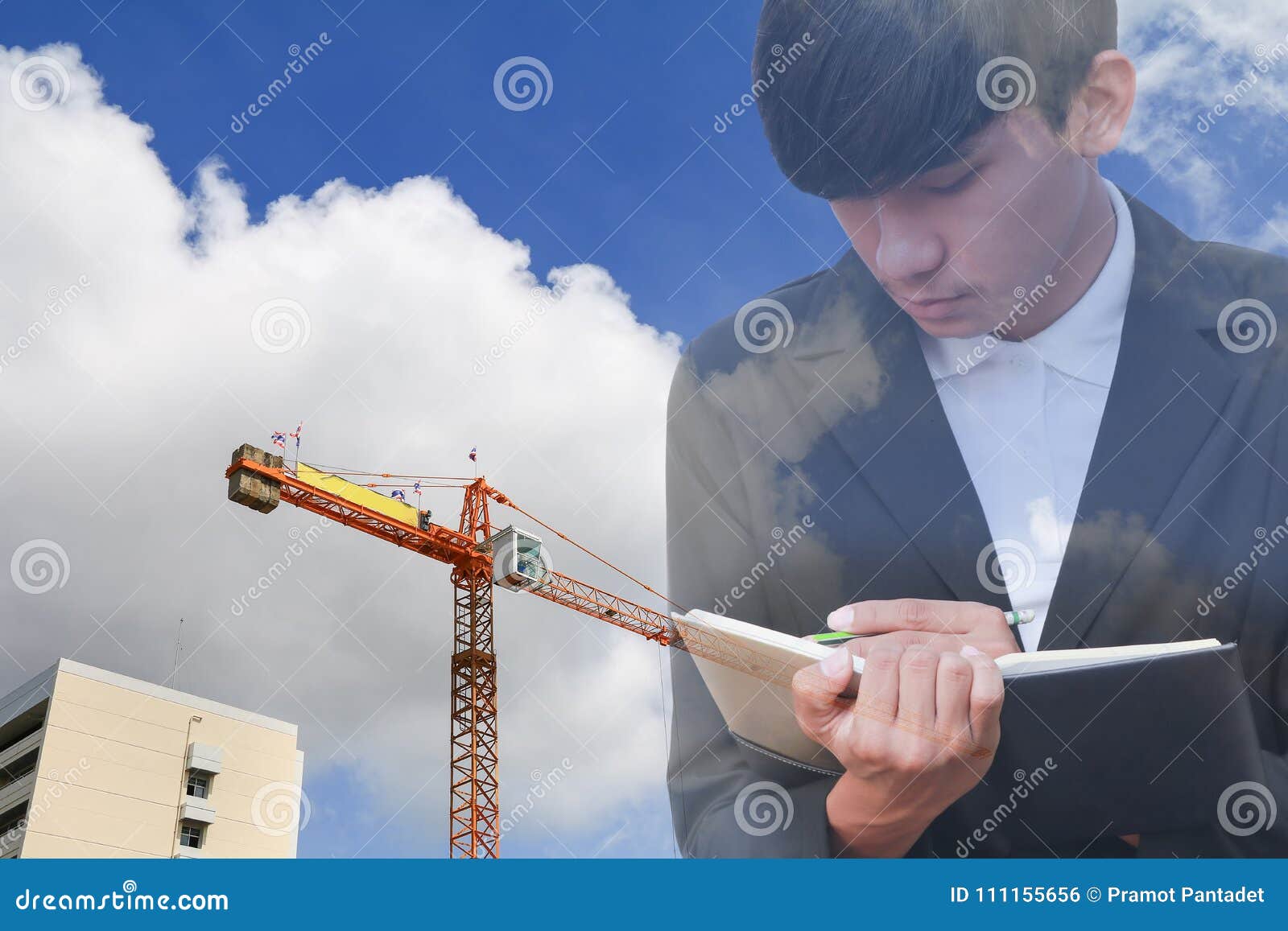 Businessman with Notepad in Hand Signing Documents in Construction Site ...
