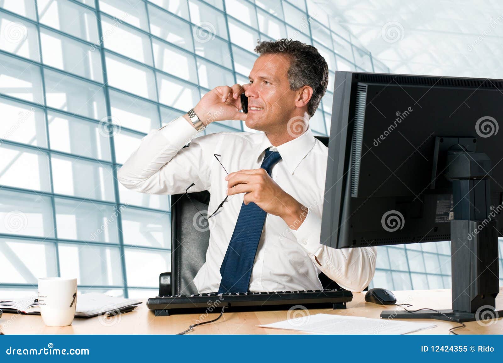 Businessman in office stock image. Image of confident - 12424355