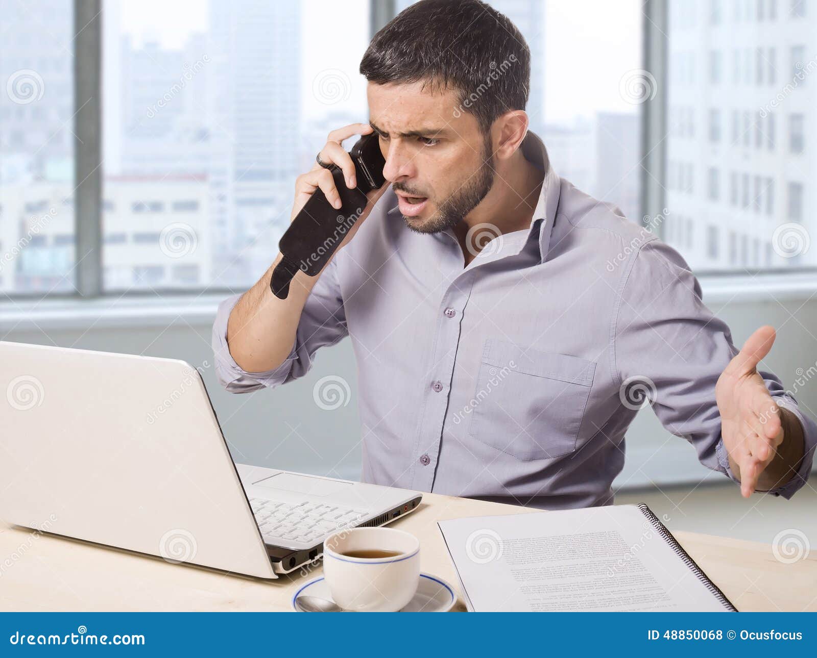 Businessman at Office in Front of Skyscraper Window View Talking Upset ...