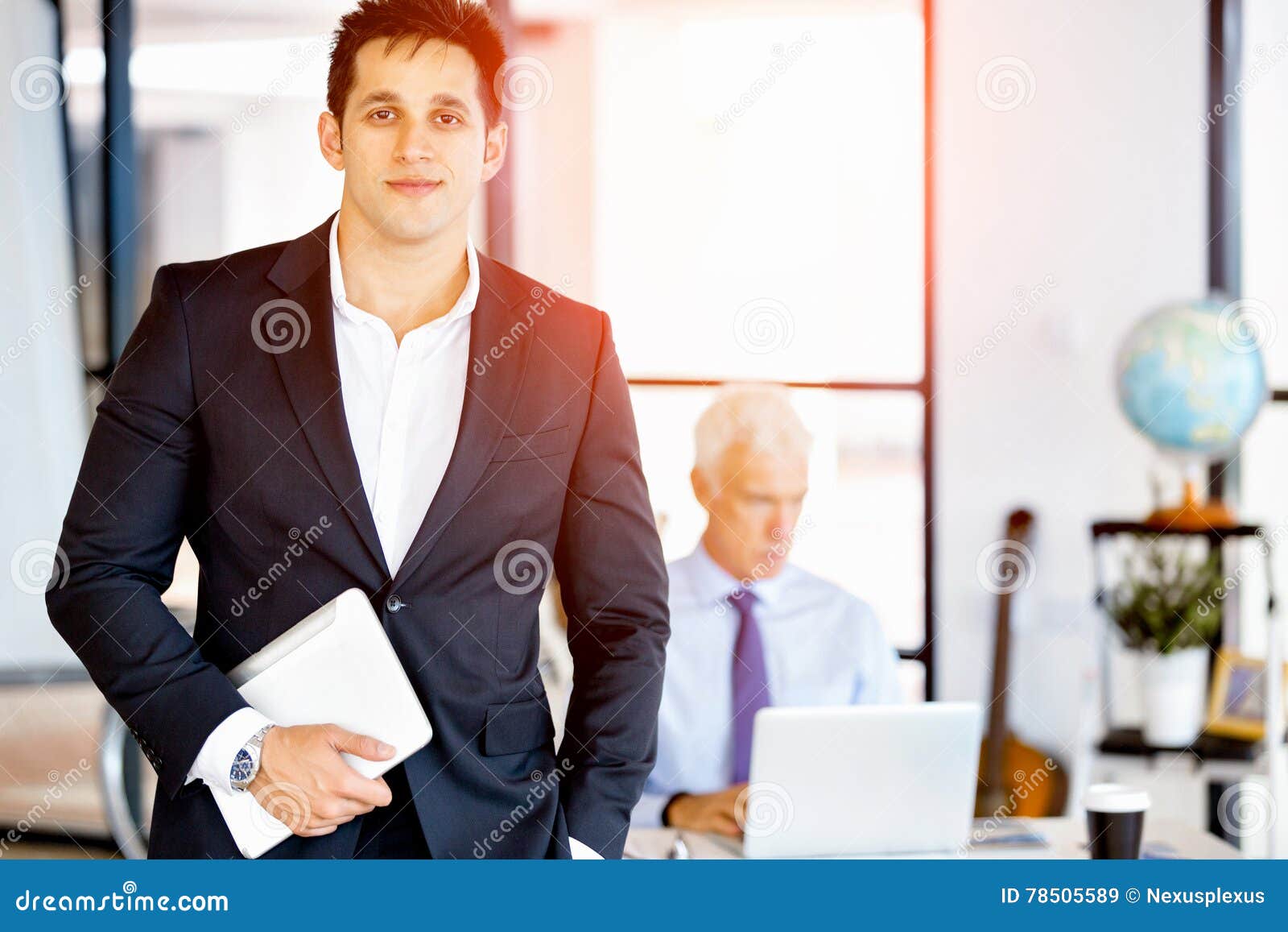 Businessman at the office stock image. Image of attractive - 78505589