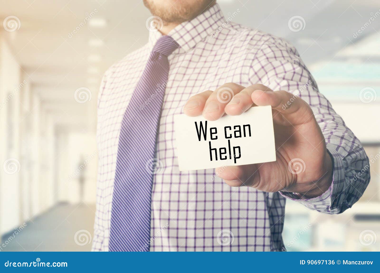 Businessman in Office Showing Card with Text: we Can Help Stock Photo ...