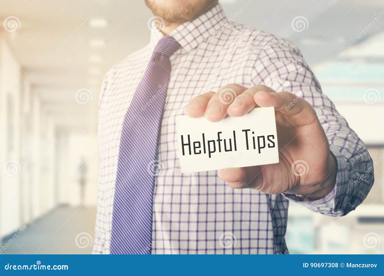 Businessman in Office Showing Card with Text: Helpful Tips Stock Photo ... Businessman in Office Showing Card with Text: Helpful Tips Stock Photo ...