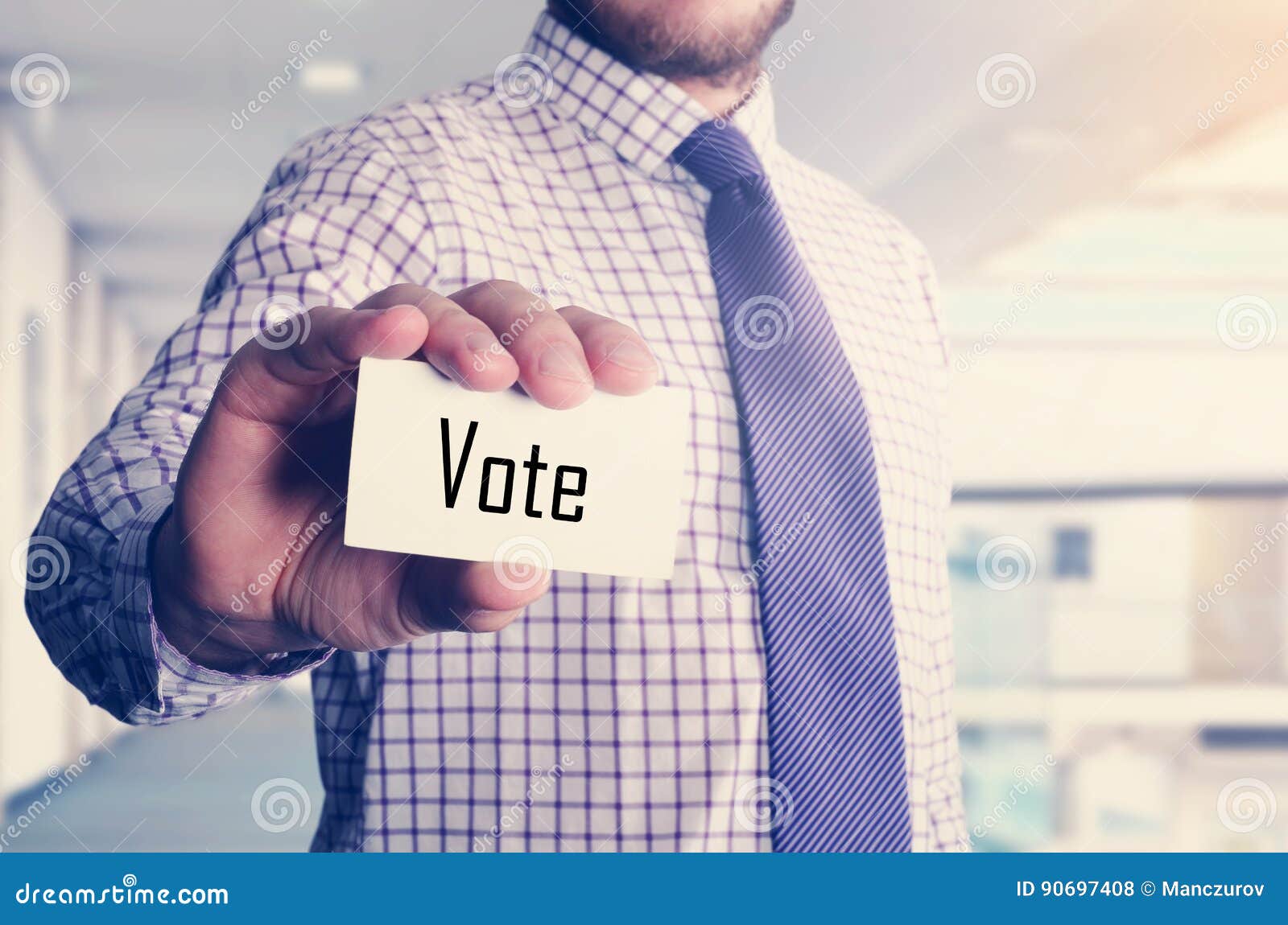 Businessman in Office Showing Card with Text: Vote Stock Photo - Image ...