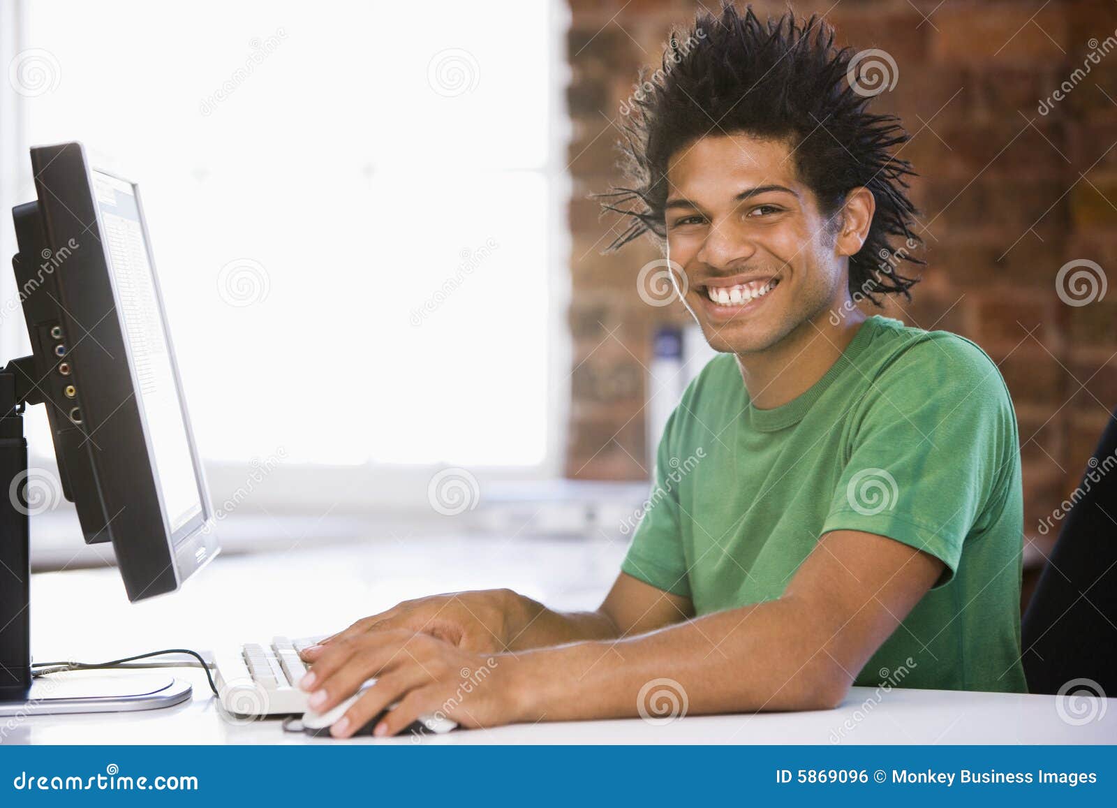 Businessman in Office Typing on Computer Smiling Stock Photo - Image of ...